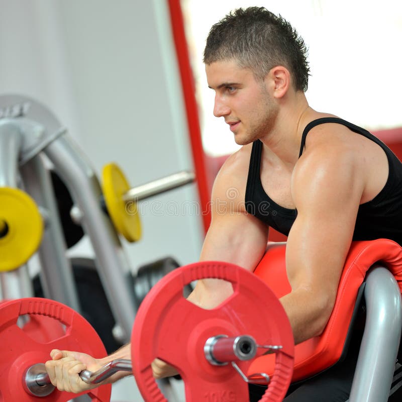 Young Man Exercising in the Gym Stock Photo - Image of recreation ...