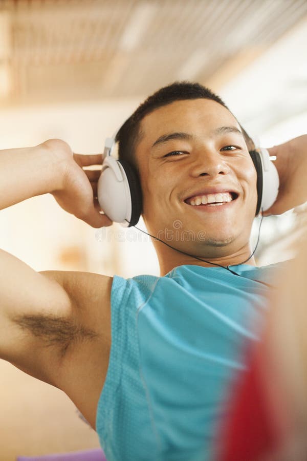 Young Man Exercising in the Gym Stock Photo - Image of balance, lying ...