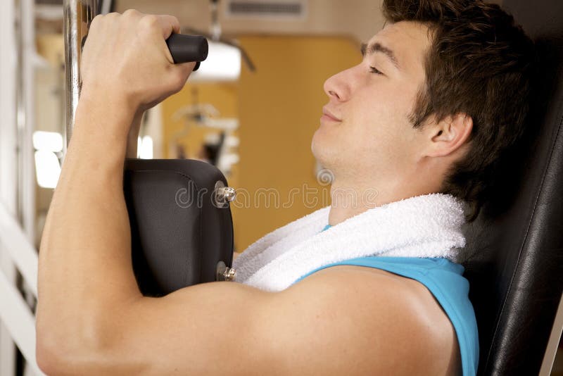 A Young Man Exercising at Gym Stock Image - Image of fitness ...