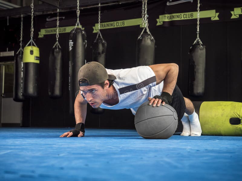Young Man Exercising Pecs in Gym with Push-ups Stock Image - Image of ...