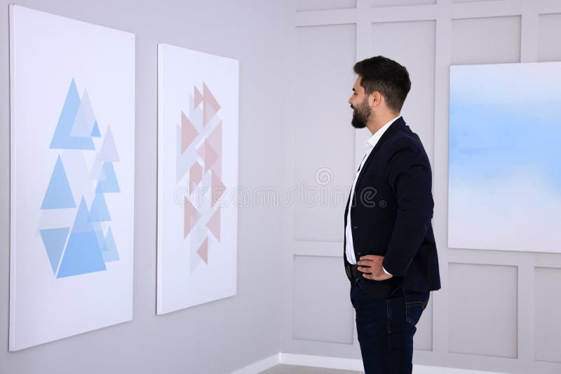 Young Man at Exhibition in Art Gallery Stock Photo - Image of male ...