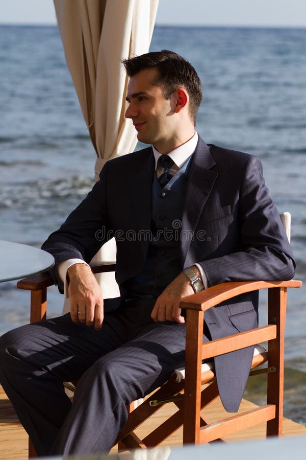 Young Man In Expensive Suit Stock Image - Image of sitting, ocean: 27319887