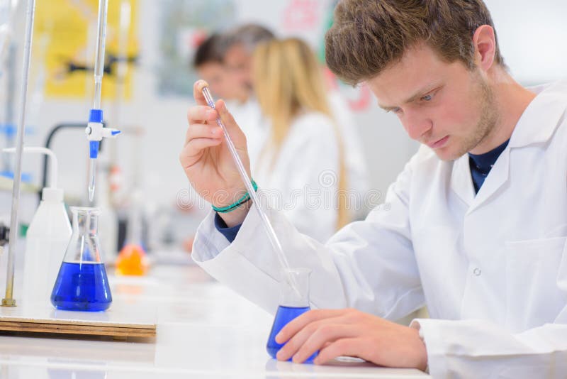 Young Man Experimenting in Lab Stock Photo - Image of explore, atom ...