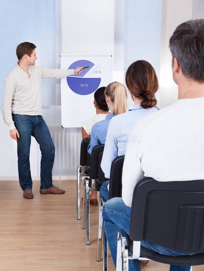 Young man explaining graph stock image. Image of female - 51568059