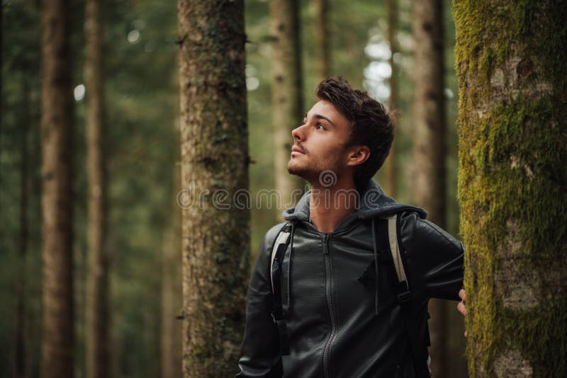 Young Man Exploring a Forest Stock Photo - Image of cool, adolescent ...