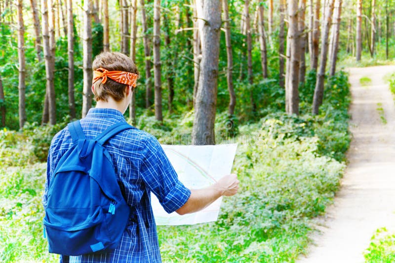 Young Man is Exploring the Map Stock Photo - Image of adventure, males ...