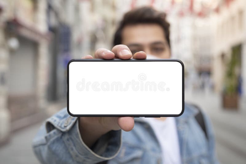 Young Man Extending His Smart Phone To the Camera Stock Image - Image ...