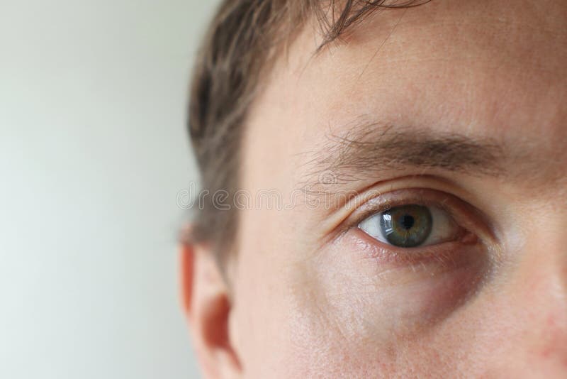 Young Man Eye Half Face stock photo. Image of facial - 243754874
