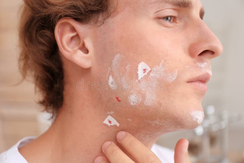 Young Man with Face Hurt while Shaving Stock Photo - Image of ...