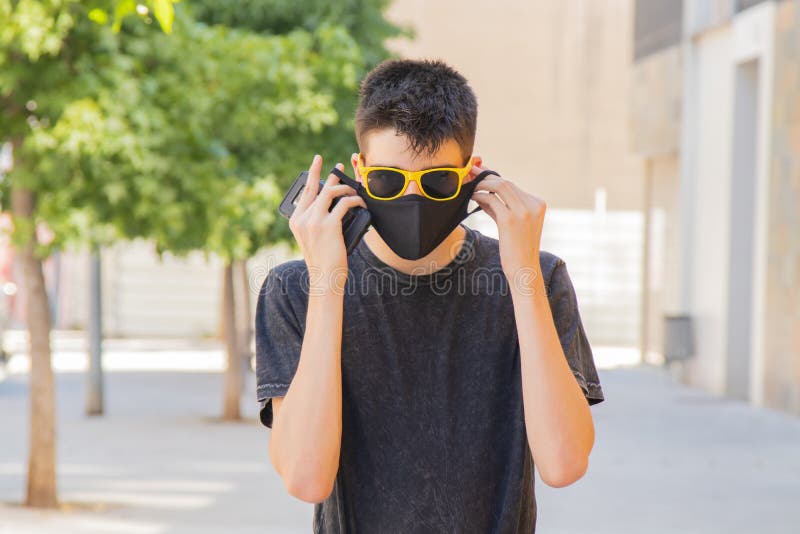 Young man with face mask stock image. Image of coronavirus - 194518797