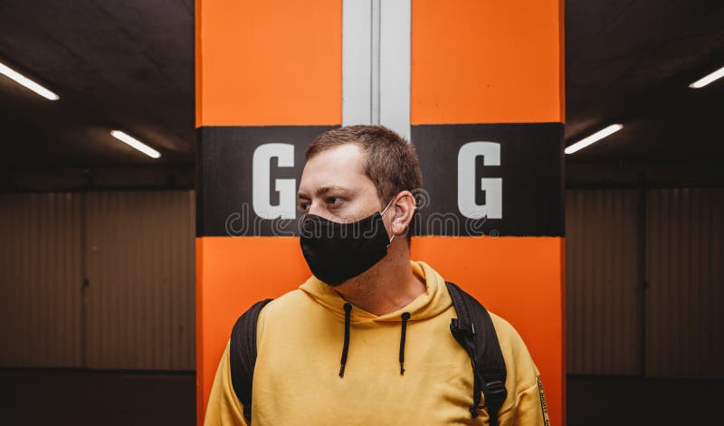 Young Man with Face Mask in the Garage Stock Photo - Image of next ...
