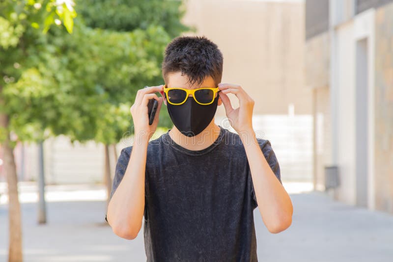 Young man with face mask stock photo. Image of brown - 194518802