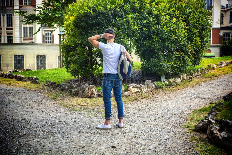 Young Man Facing Choice between Two Different Stock Photo - Image of ...