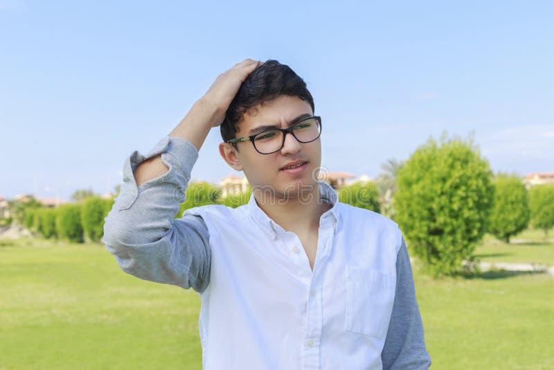 Young Man Facing a Problem Putting Hand Over His Head. Stock Photo ...