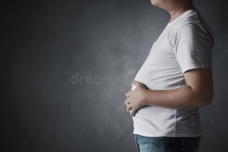 Young men with fat belly stock photo. Image of hand - 225404844
