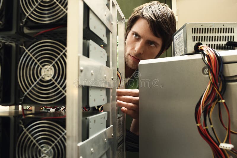 Young Man Fixing Computer Equipment Stock Image - Image of young ...