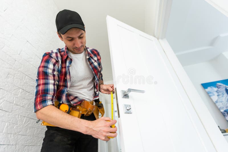 Young Man Fixing a Door Lock Stock Photo - Image of house, locksmith ...