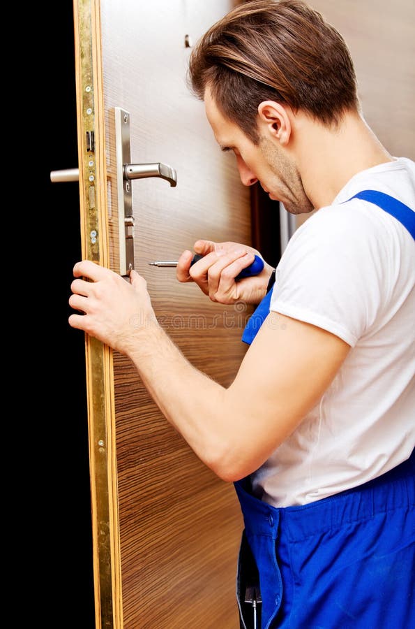 Young Man Fixing the Door with Screwdriver Stock Image - Image of ...