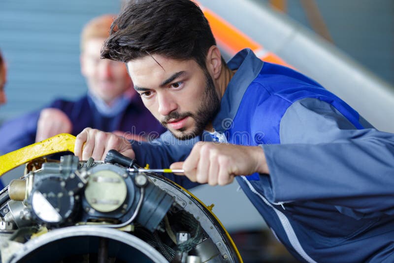 Young man fixing machine stock image. Image of tightened - 310488051