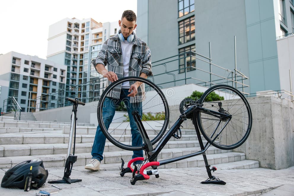 Young Man Fixing a Problem with the Tire Stock Image - Image of cycling ...