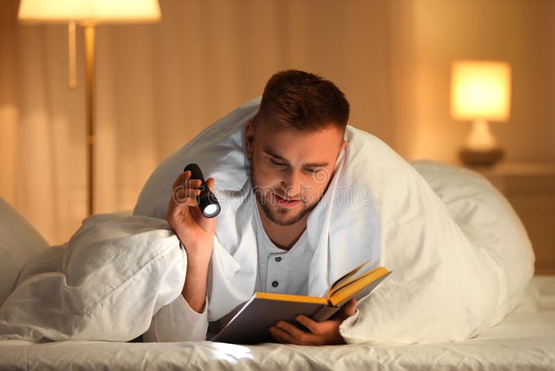 Young Man with Flashlight Reading Book Stock Image - Image of read ...