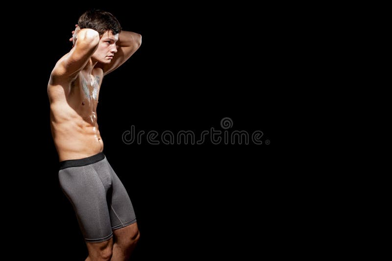 Young Man Flexing Abs stock photo. Image of shirtless - 16173464