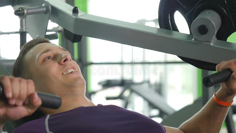 Young Man Flexing Chest Muscles on Gym Machine Stock Footage - Video of ...