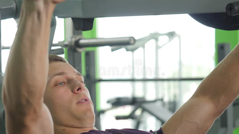 Young Man Flexing Chest Muscles on Gym Machine Stock Footage - Video of ...