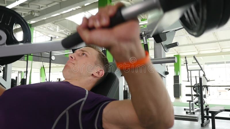 Young Man Flexing Chest Muscles on Gym Machine Stock Footage - Video of ...