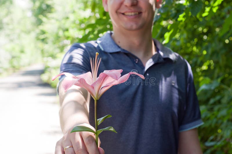 The Young Man with a Flower Stock Image - Image of green, give: 26010239