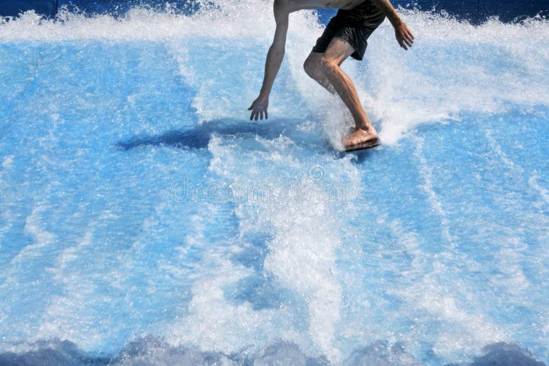 Young Man Flowriding and Flowboarding on Artificial Sheet Waves Stock ...