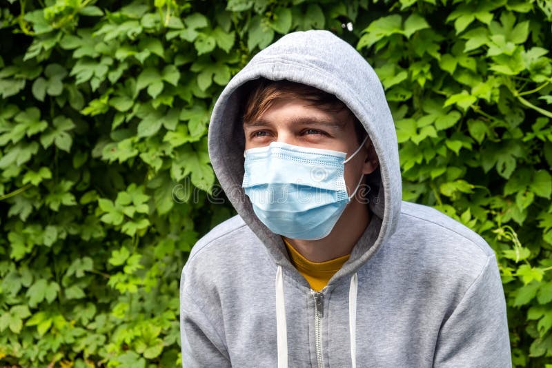 Young Man with a Flu Mask stock image. Image of hoodie - 224089465