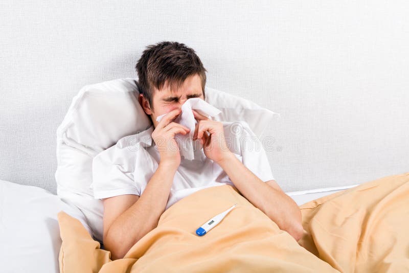Young Man with a Flu stock photo. Image of sofa, illness - 152947410