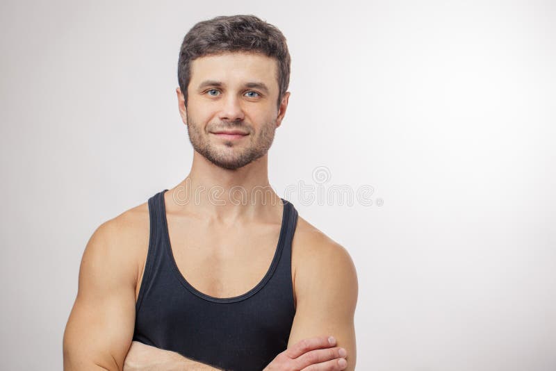 Young Man with Folded Arms in Black Singlet Stock Photo - Image of ...