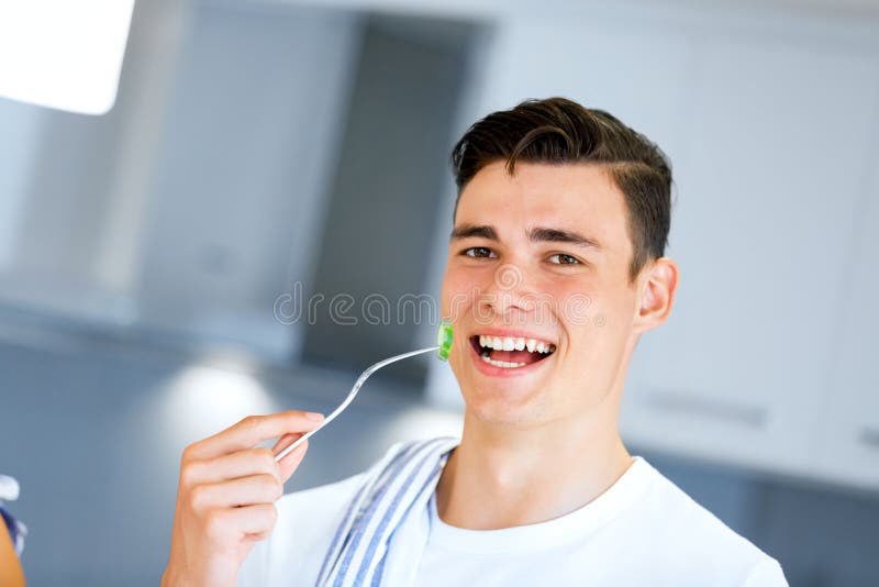 Young man with a fork stock image. Image of diet, cutlery - 133320161