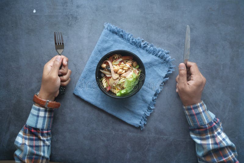 Young Man with Fork Waiting in from on a Plate Full of Vegetable Stock ...