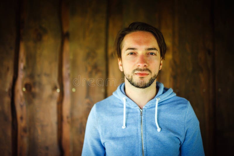 Young Man in Front of Wooden Wall Stock Image - Image of european ...