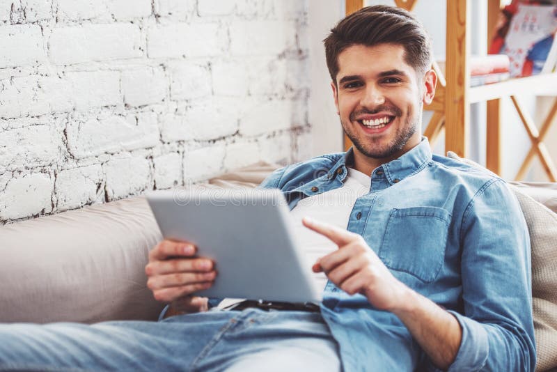 Young Man with Gadget at Home Stock Photo - Image of break, attractive ...