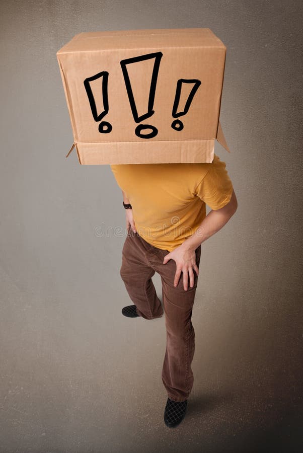 Young Man Gesturing with a Cardboard Box on His Head with Exclamation ...