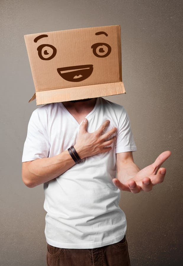 Young Man Gesturing with a Cardboard Box on His Head with Smiley Stock ...