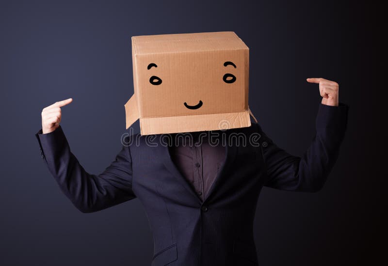 Young Man Gesturing with a Cardboard Box on His Head with Smiley Stock ...
