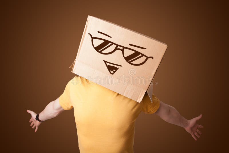 Young Man Gesturing with a Cardboard Box on His Head with Smiley Stock ...