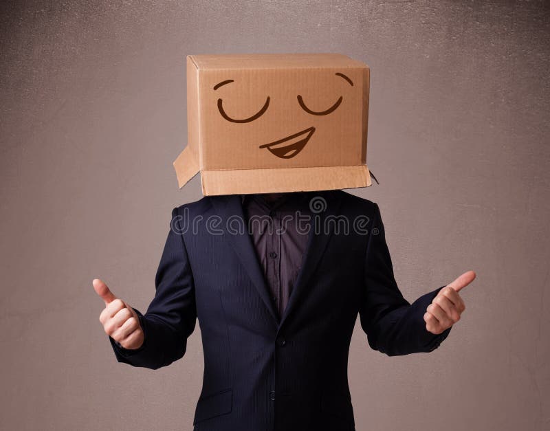 Young Man Gesturing with a Cardboard Box on His Head with Smiley Stock ...