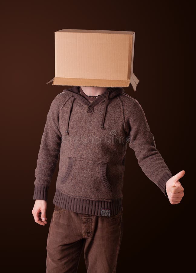 Young Man Gesturing with a Cardboard Box on His Head Stock Photo ...