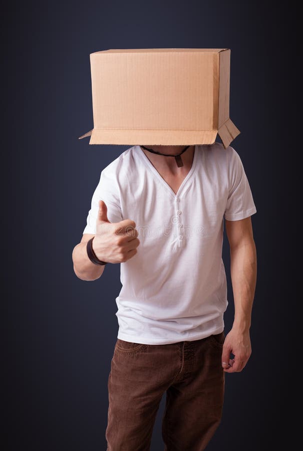 Young Man Gesturing with a Cardboard Box on His Head Stock Photo ...
