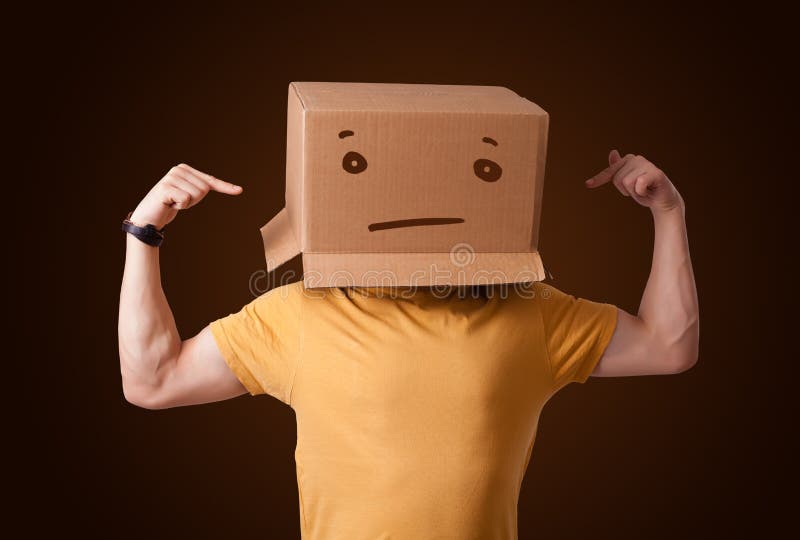 Young Man Gesturing with a Cardboard Box on His Head with Smiley Stock ...