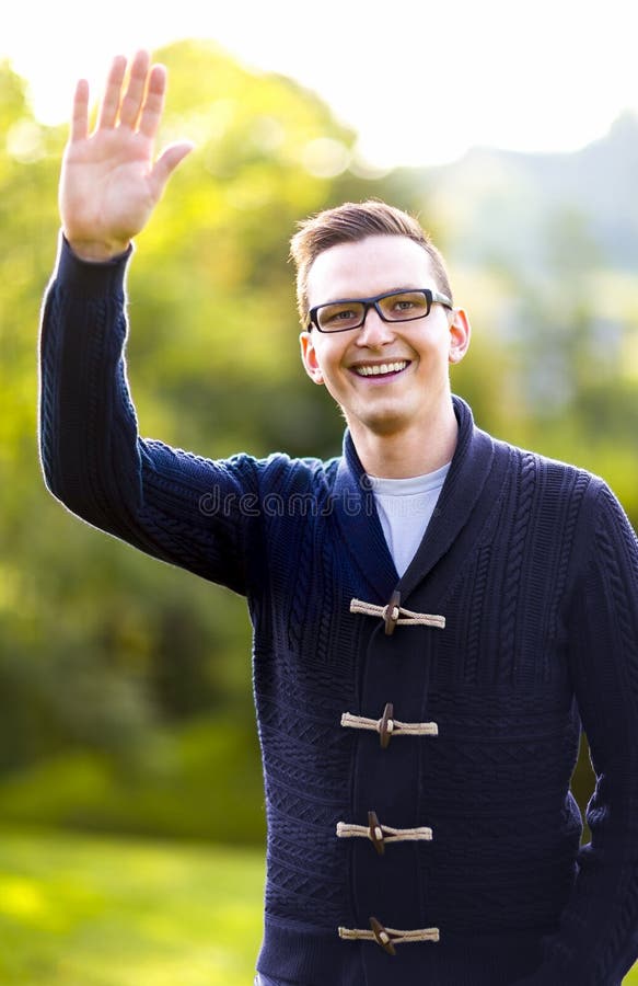 Young man gesturing hello stock image. Image of adult - 84995275