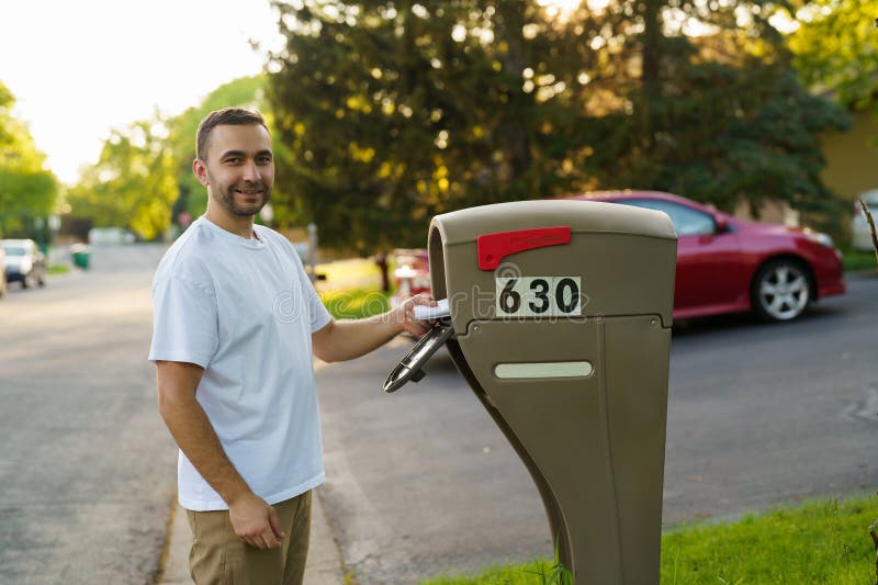 Young Man Getting His Mail from His Mailbox Stock Image - Image of ...