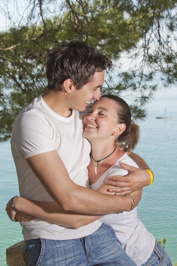 Young man and girl necking stock photo. Image of face - 24768974