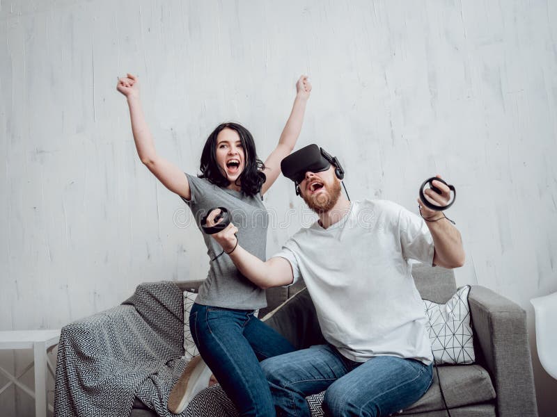 The Young Man with Girlfriend Playing Games with Virtual Reality ...